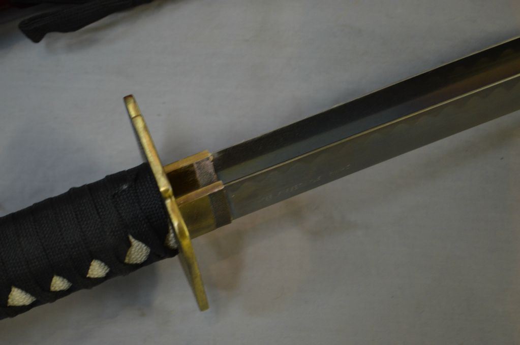 Three replica swords including shot gun motif sword and sheath ...
