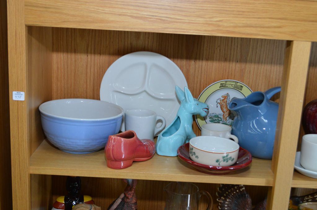 Shelf lot of Medalta pottery collectibles including lamp base, figural ...