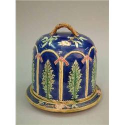 A 19th century Continental majolica cheese dome and stand, with foliate ...