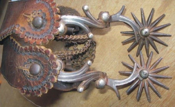 silver inlaid Tapia Style spurs with early straps