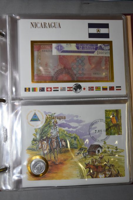 Two "World's First Coin, Stamp & Banknote Collection" including volumes ...