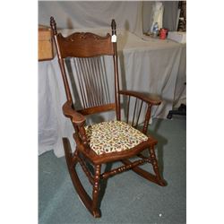 Antique quarter cut oak spindle back rocking chair with upholstered seat