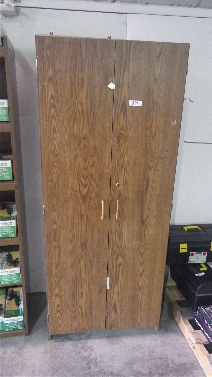 Upright wardrobe / storage unit with doors and wood colored finish