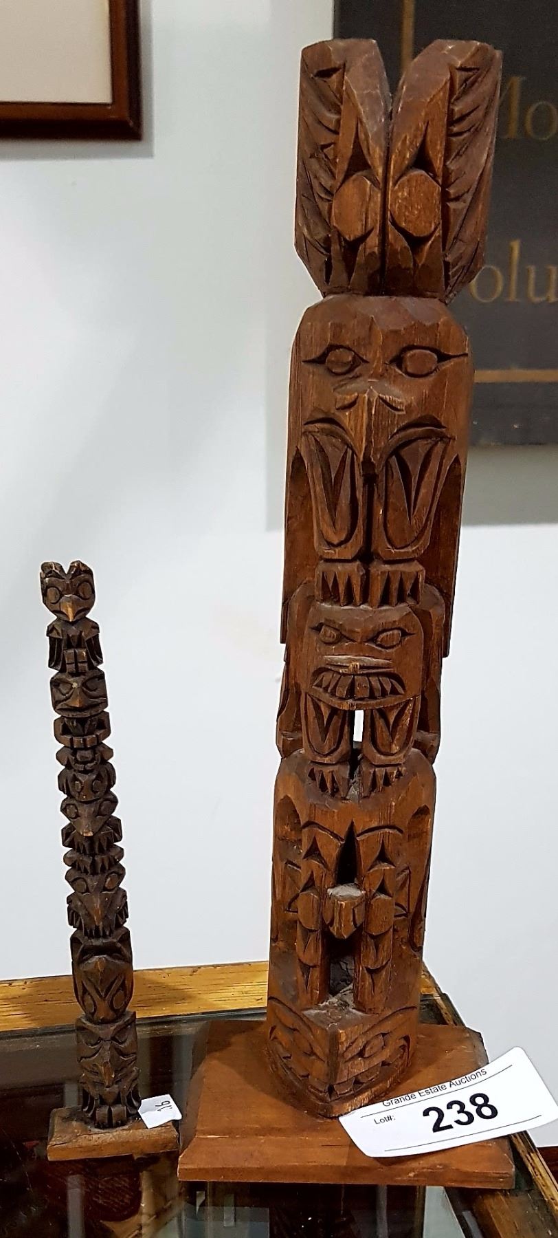 TWO NATIVE CARVED TOTEM POLES