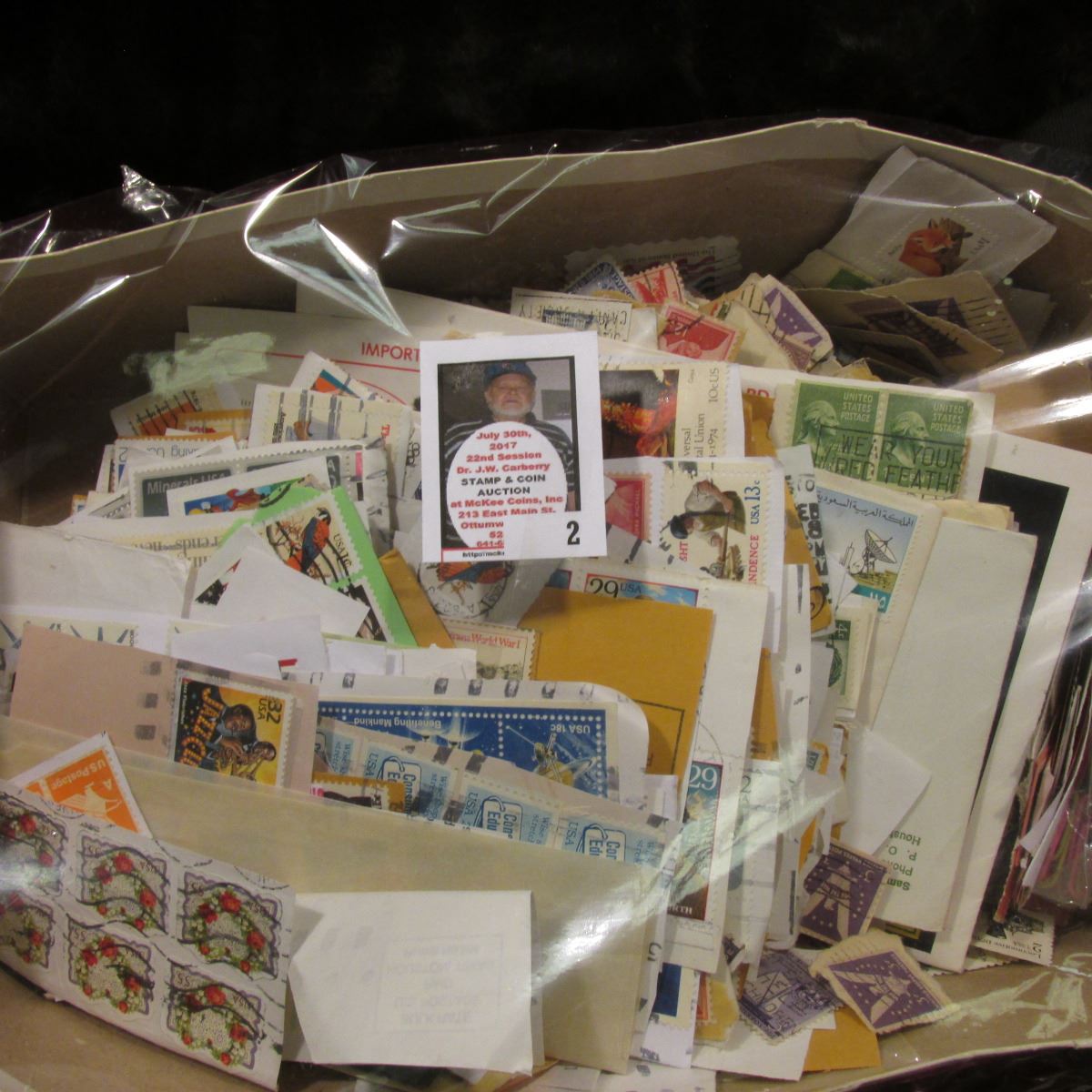 Shoe box full of old used Postage Stamps.