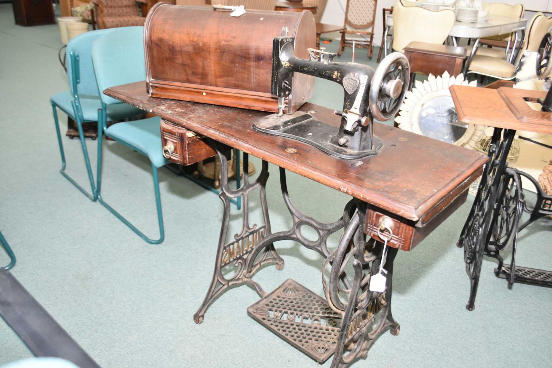 Antique treadle "New Williams" sewing machine in wooden case