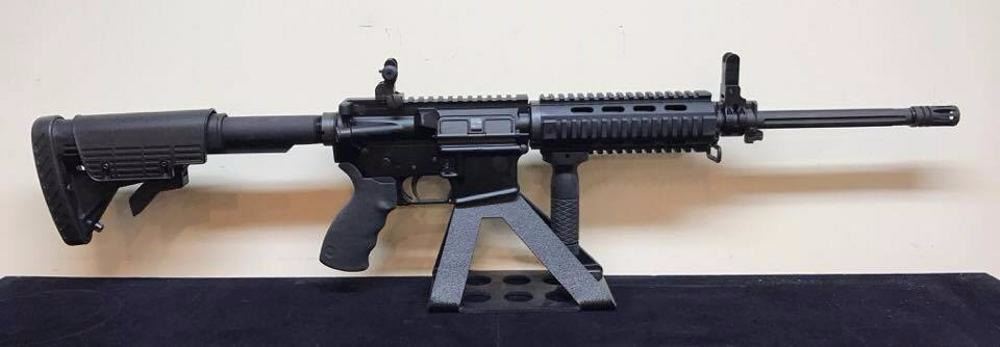 Bushmaster XM15 5.56 Fluted Barrel, Quad Rail Iron Sights P Sniper Scope