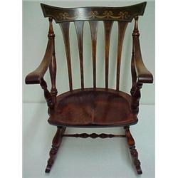 Mahogany rocking chair, curved crest rail with