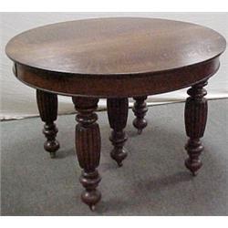 Round oak dining table, apron with rope turned