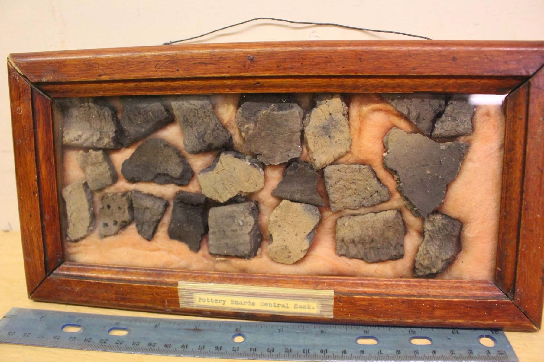 Pottery Shards In Display Case (Central Sask)