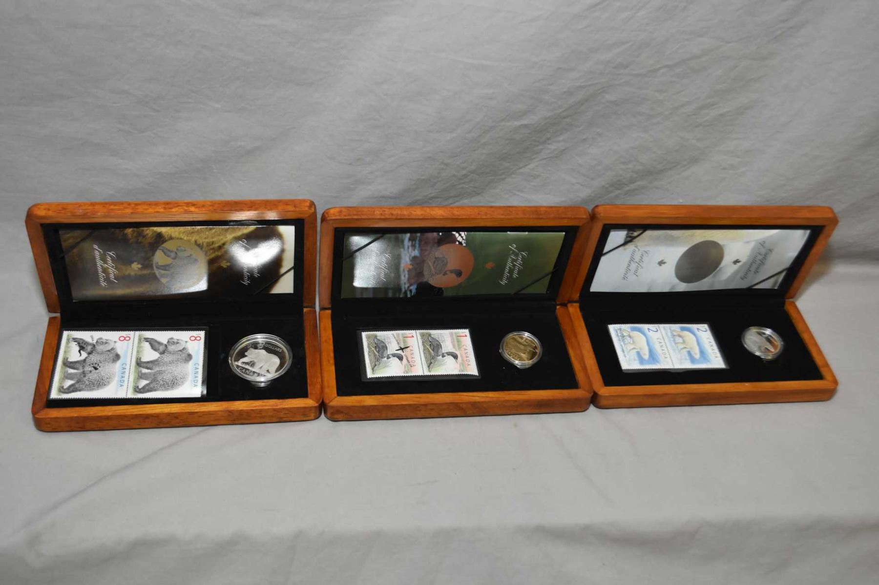 Three Canada post office wood cased limited edition stamp and coins ...