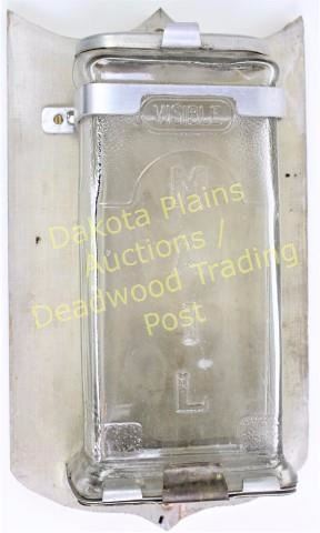 Antique visible glass mailbox embossed MAIL on front and mounted to ...