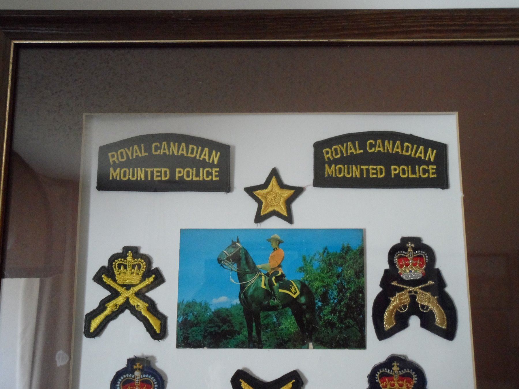 lot of RCMP patches framed