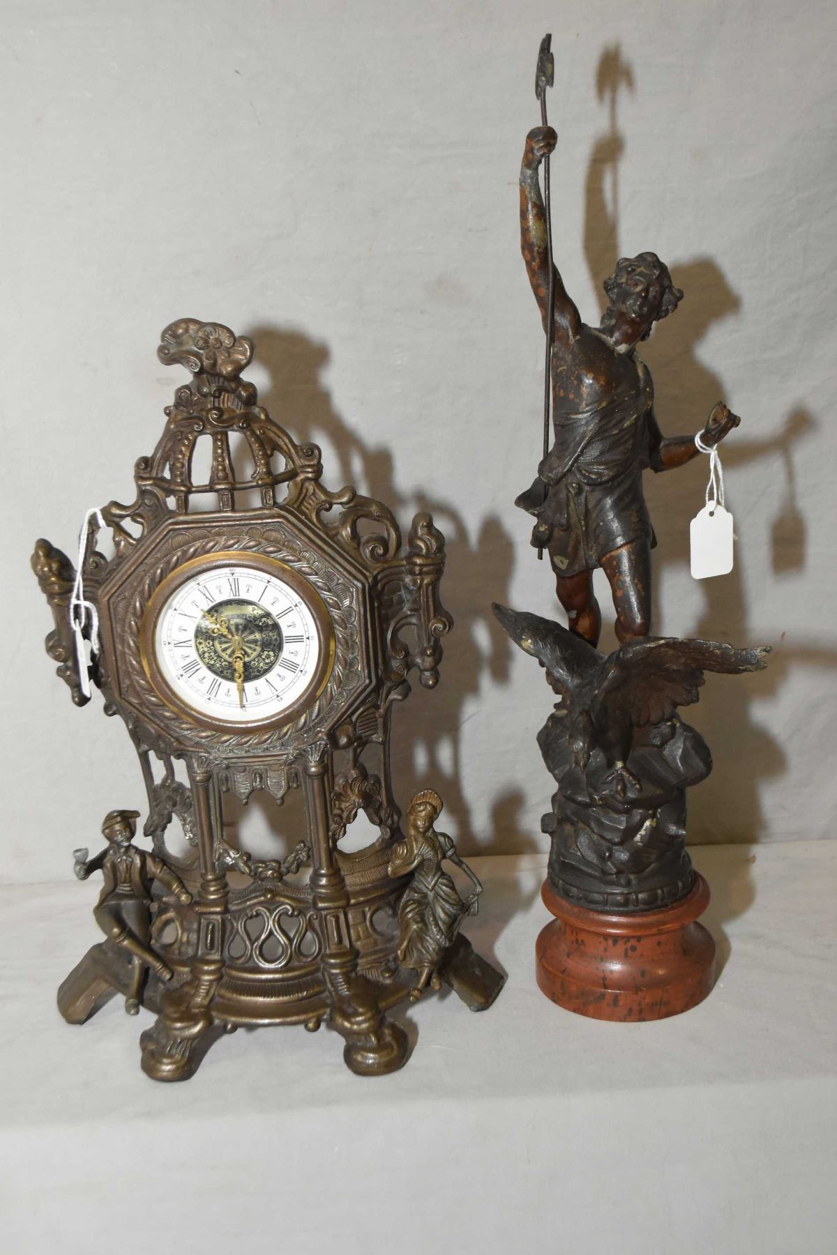 Spelter figure and cast figural clock
