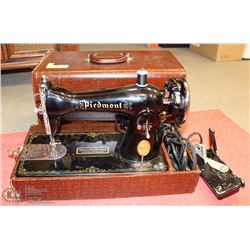 VINTAGE PIEDMONT SEWING MACHINE WITH FOOT PEDAL.