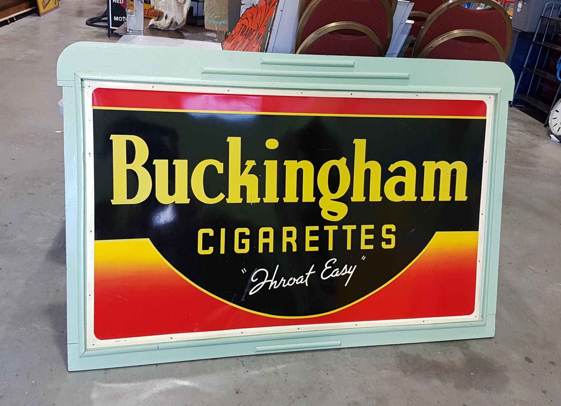 1948 BUCKINGHAM CIGARETTES METAL SIGN IN WOOD FRAME