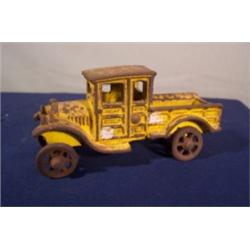 Two vintage cast iron toy trucks