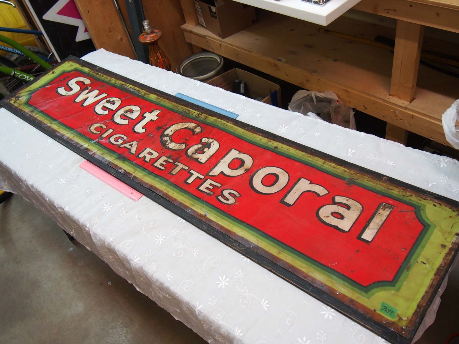 Sweet Caporal Cigarettes Tin Sign Mounted on Wood.
