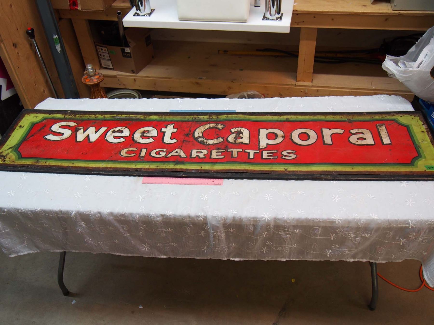 Sweet Caporal Cigarettes Tin Sign Mounted on Wood.