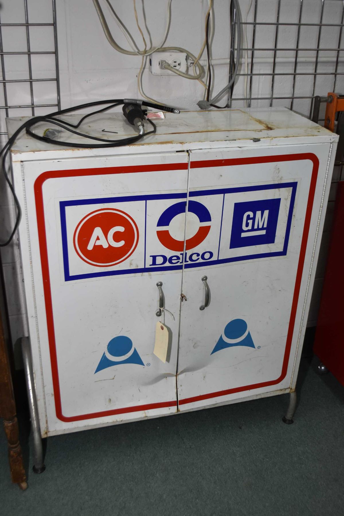 Vintage AC Delco shop cabinet containing assorted part including ...