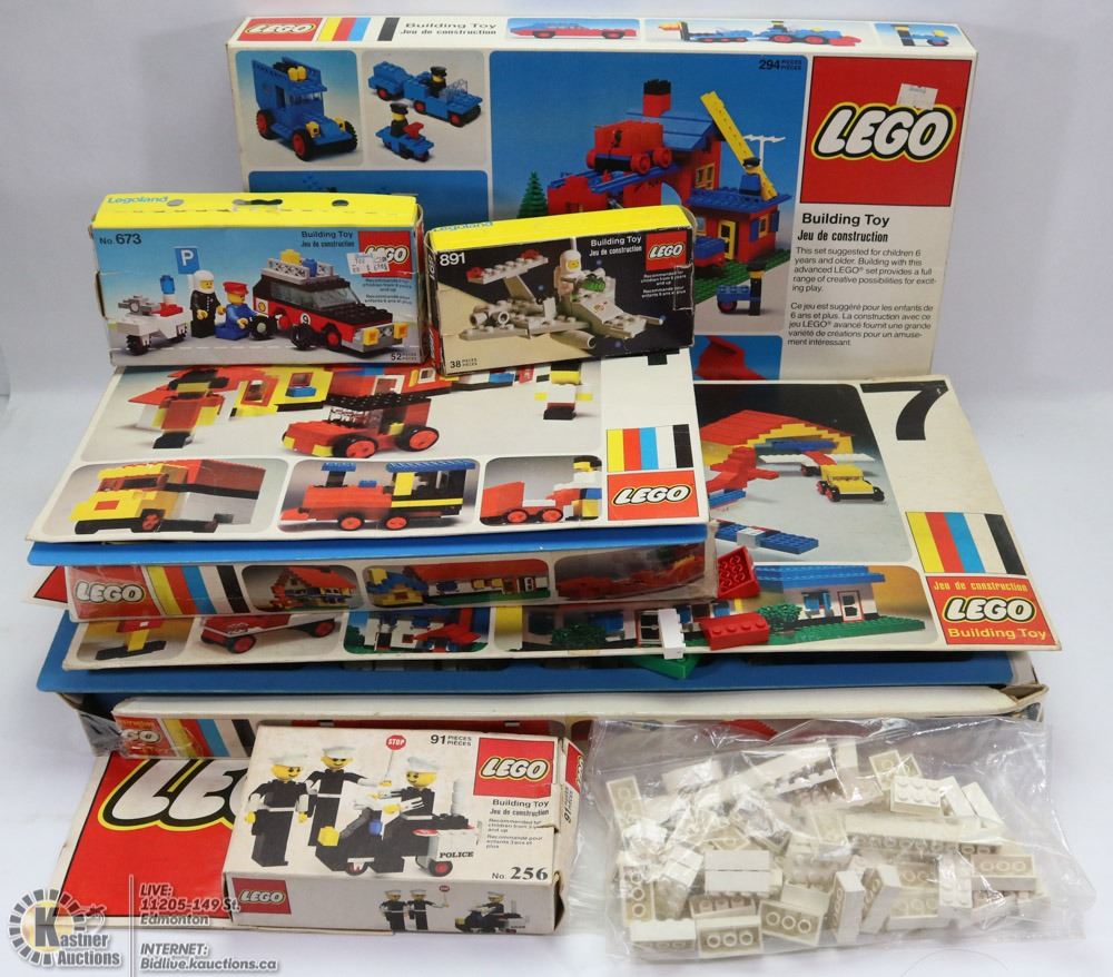 BOX FULL OF 1970S LEGO SETS WITH BOXES.