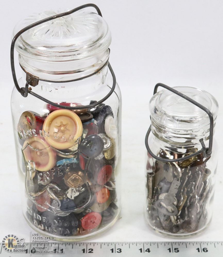 LOT OF 2 FILLED OLDER BALE WIRE SNAP JARS.