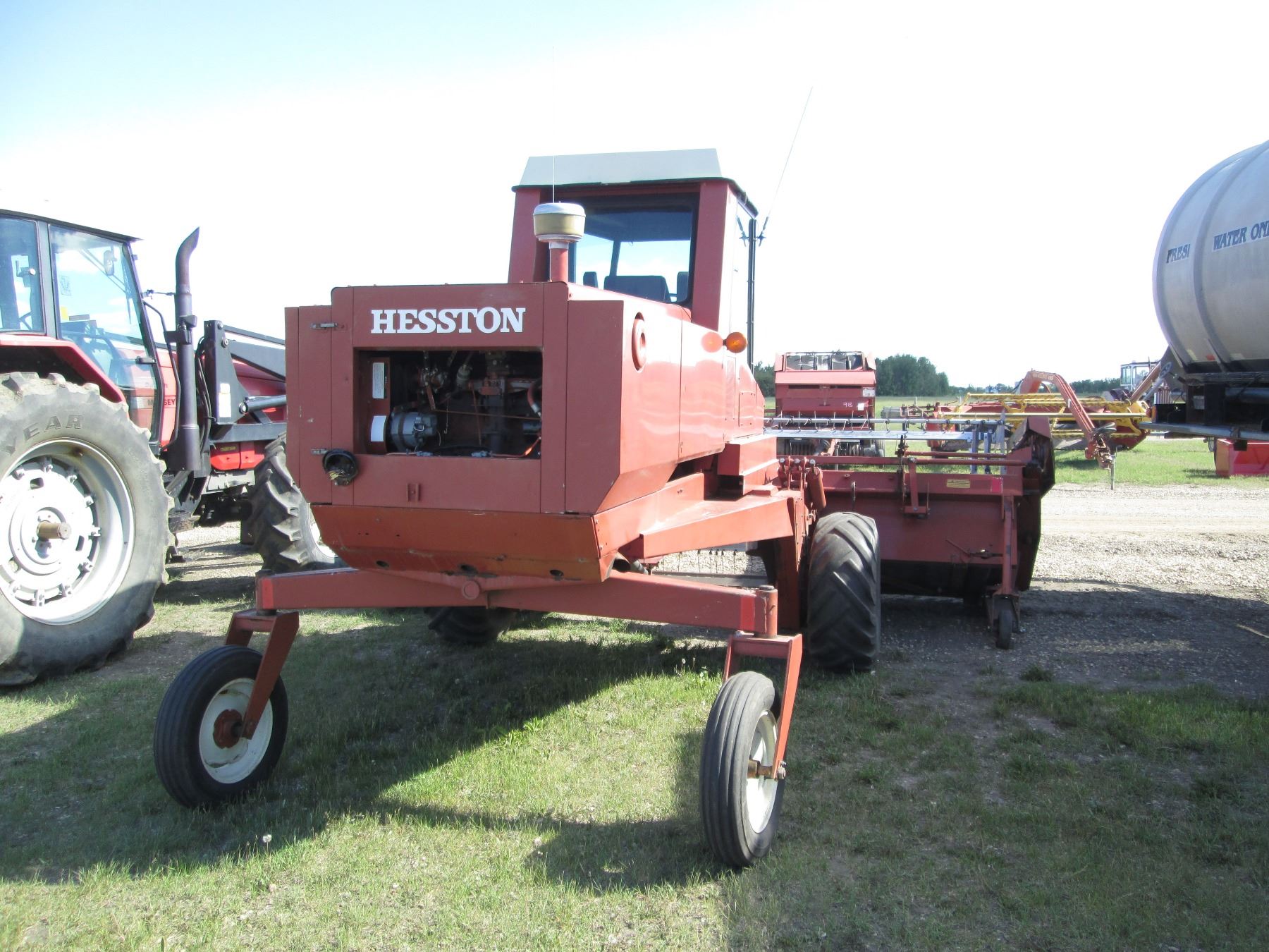 15' HESSTON 6450 SWATHER, CAB, AIR, C/W HAY CRIMPER, 2 EXTRA KNIVES ...
