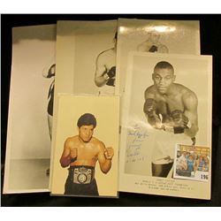 Group of Black & white Autographed Boxing Photos. Includes "Rocky ...