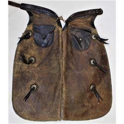 Bat wing chaps with stamped tooling on belt,