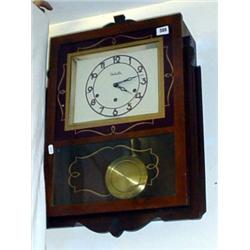 A mahogany cased Art Deco French wall clock by 'Vedette' Veritable ...