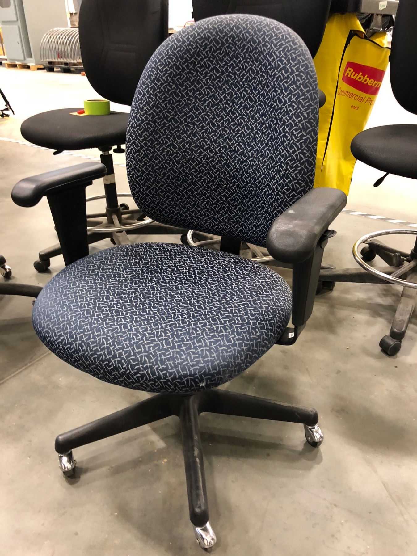 3 - Blue pattern office chairs with adjustable height. 1 chair has no ...