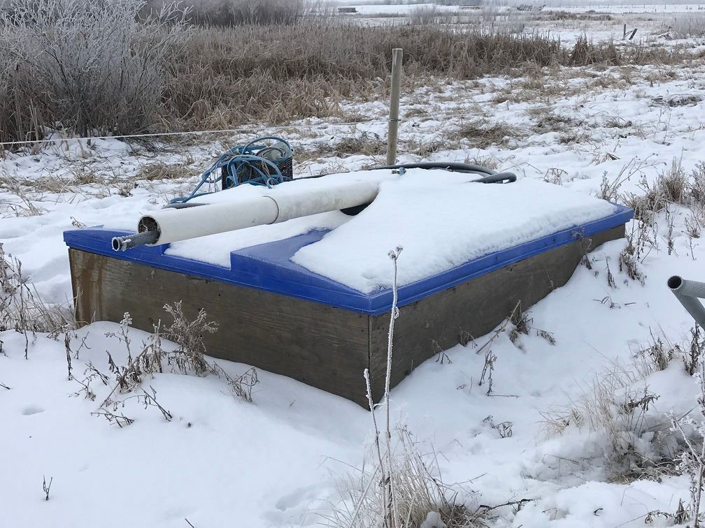 Dugout watering system. Large insulated tank, 24 Volt pump. c/w ...