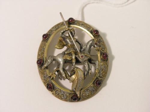 A St George and the Dragon silver gilt brooch, with cabochon garnet ...