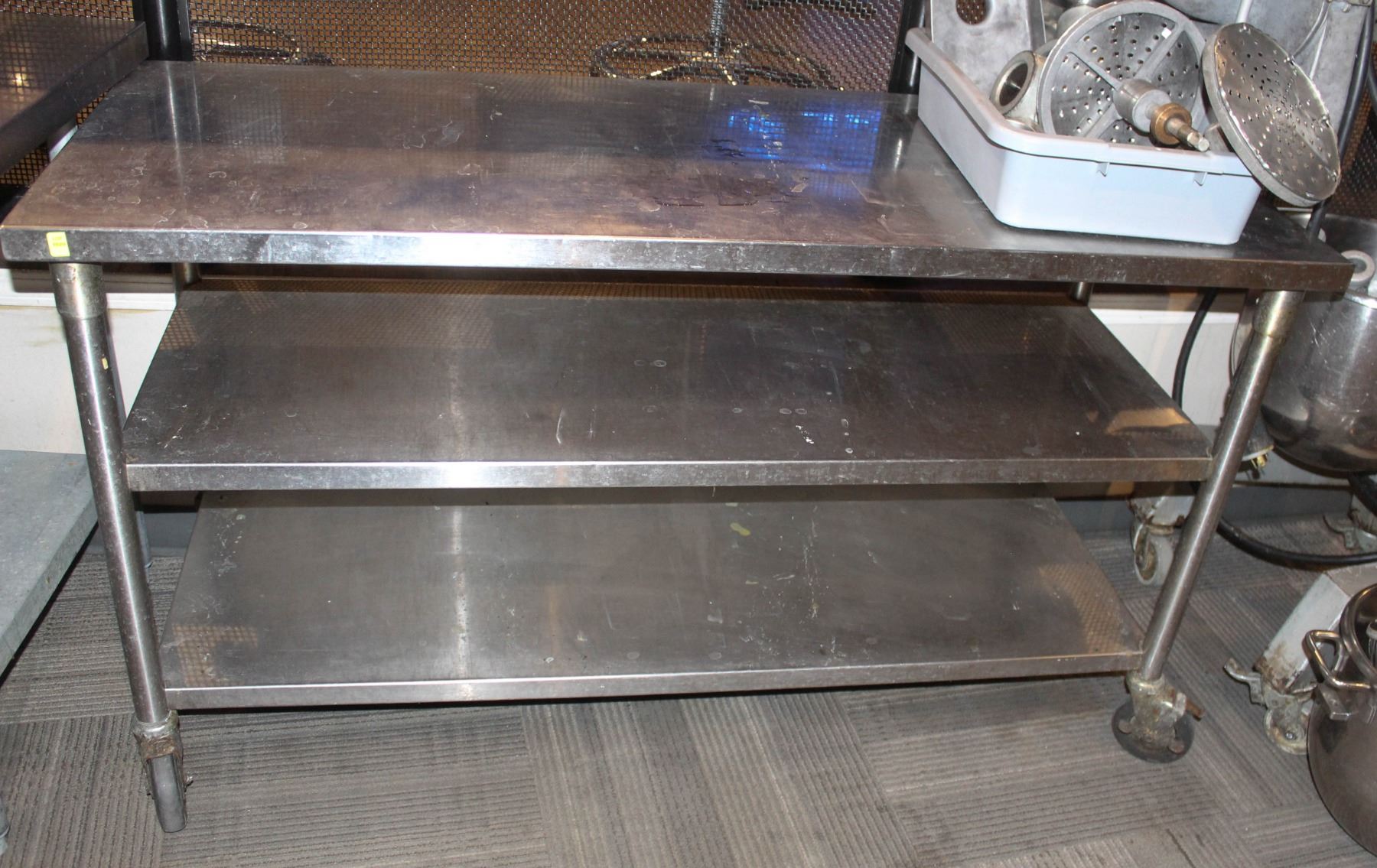 5 FOOT STAINLESS STEEL TABLE ON WHEELS