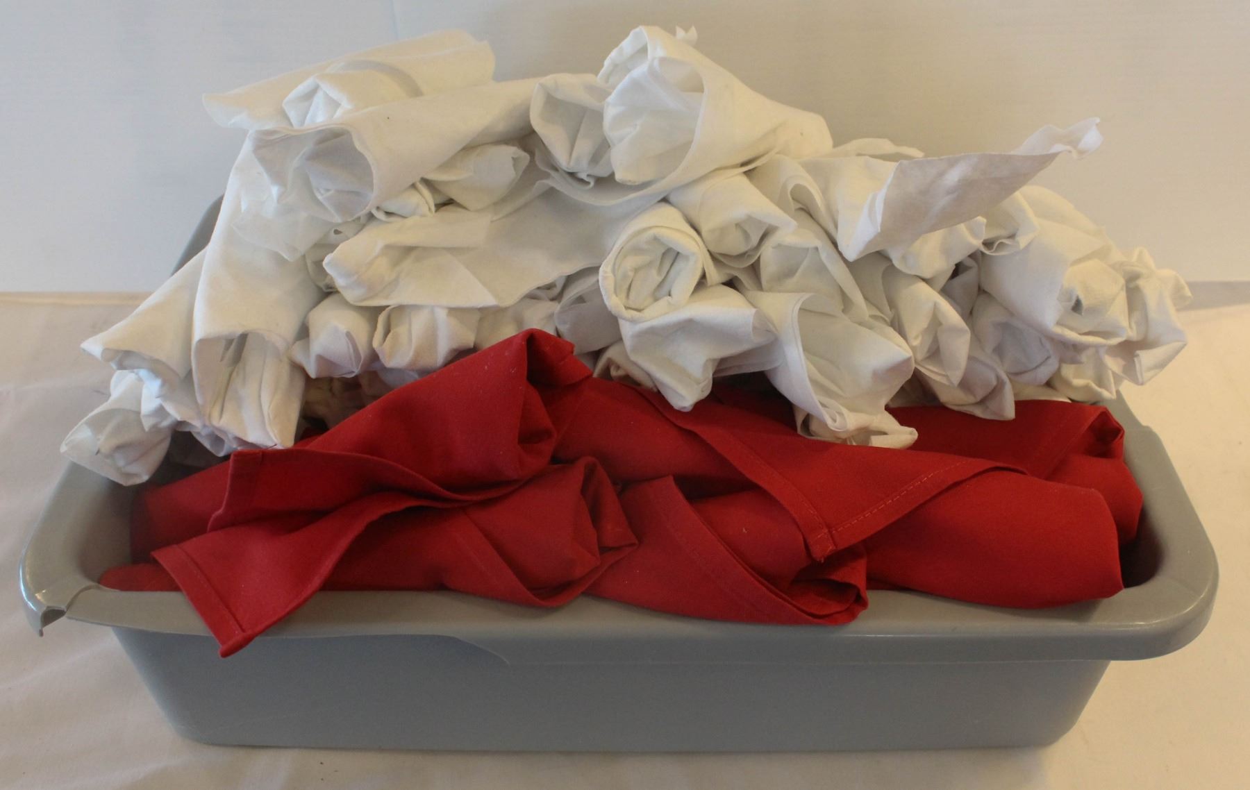 BUS TRAY WITH NAPKIN WRAPPED SETS OF SILVERWARE