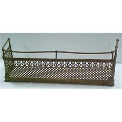 Brass fireplace bumper; round formed bar rail over