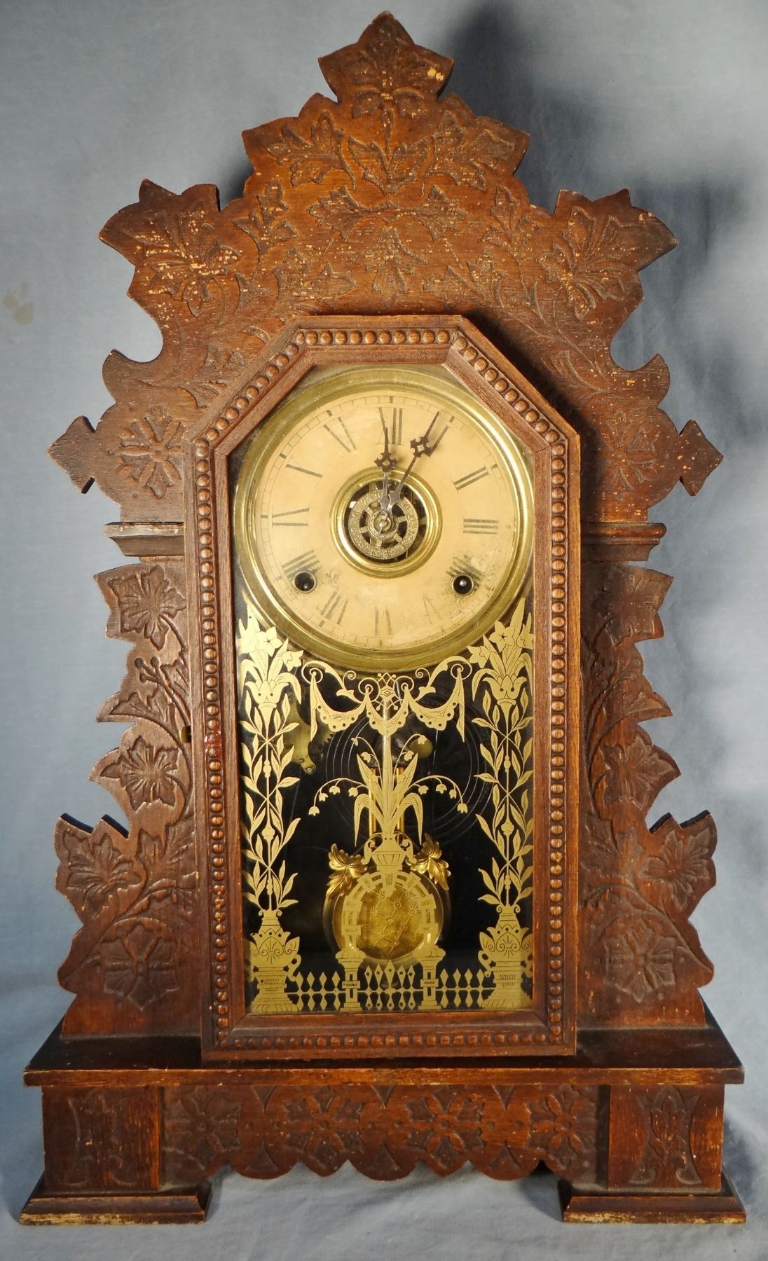Walnut ginger bread clock, ca. 1890's, 24" h