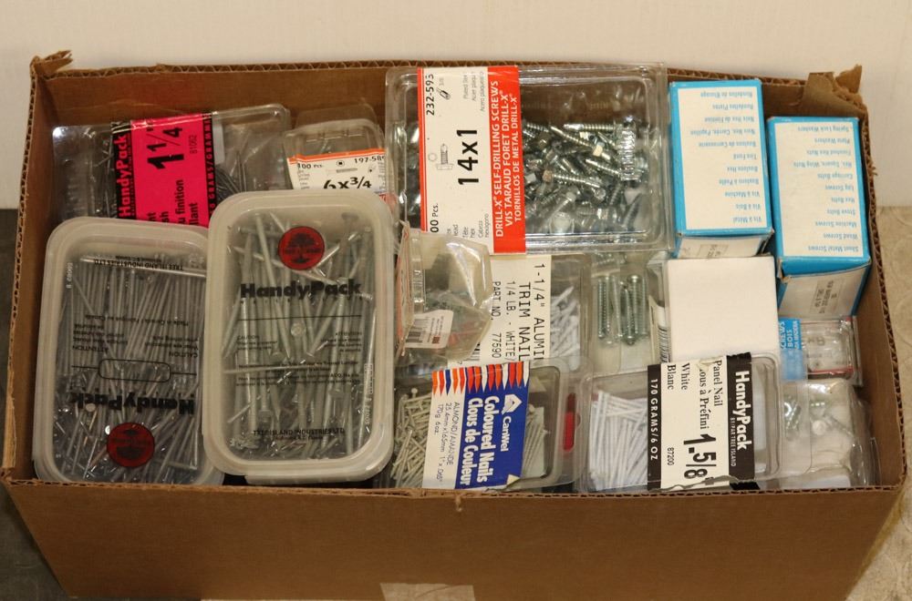 BOX WITH ASSORTED NAILS, SCREWS AND MORE.