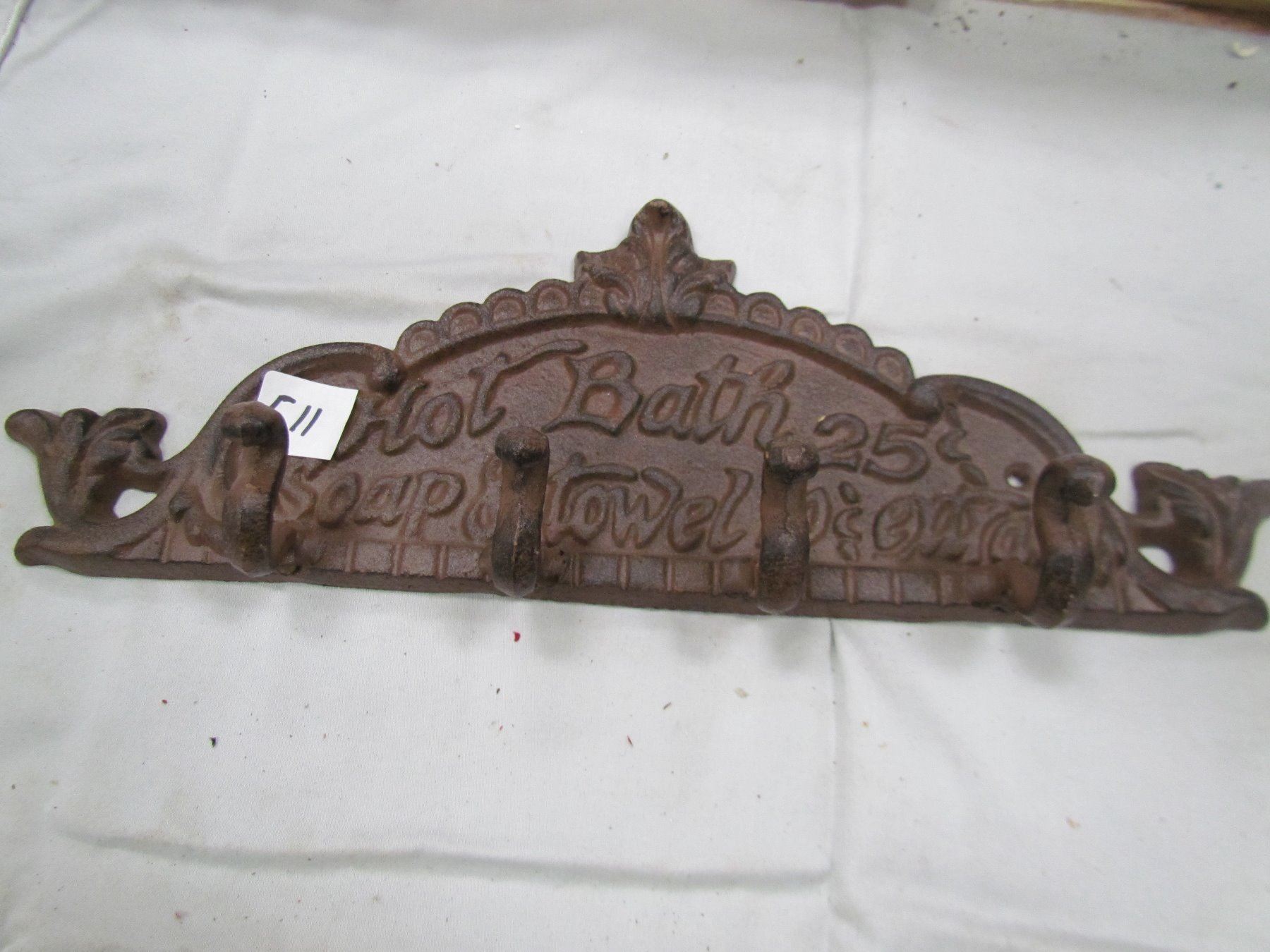 CAST IRON TOWEL RACK ( HOT BATH-25 CENTS, SOAP AND TOWEL-10 CENTS EXTRA)