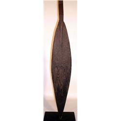A RARE LAKE SENTANI PADDLE, of wood in slender fo
