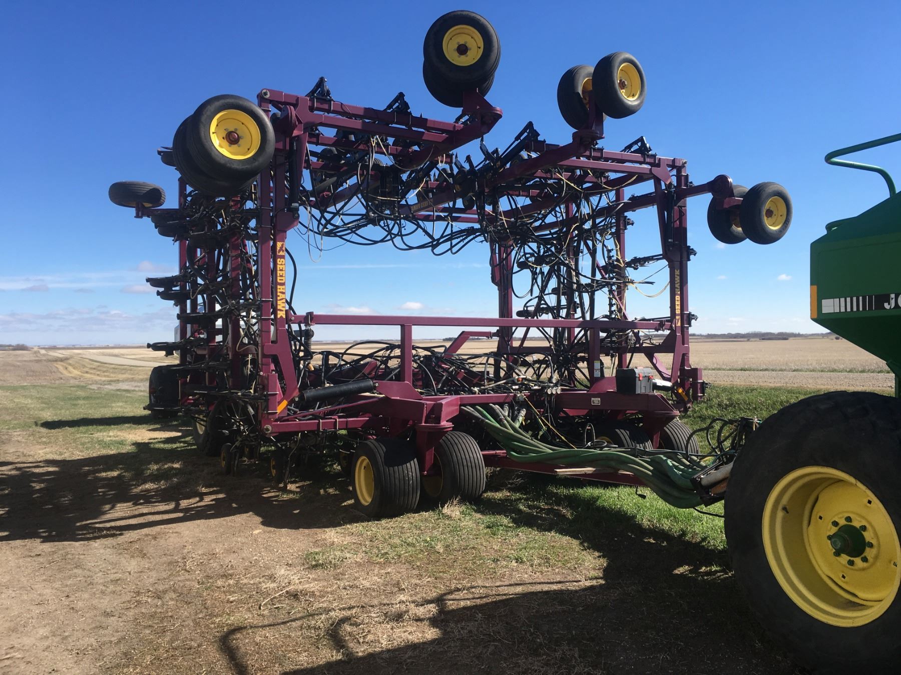 Seed Hawk Air Seeder with 787 JD Cart, Flexi Coil 2320 Fertilizer cart