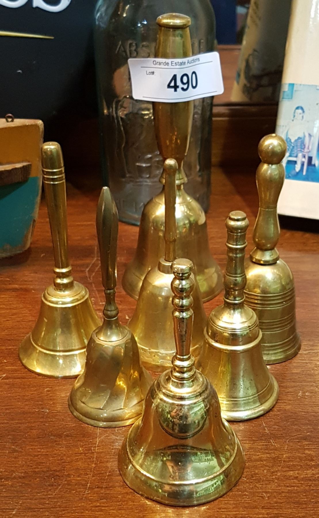 SEVEN VINTAGE BRASS BELLS