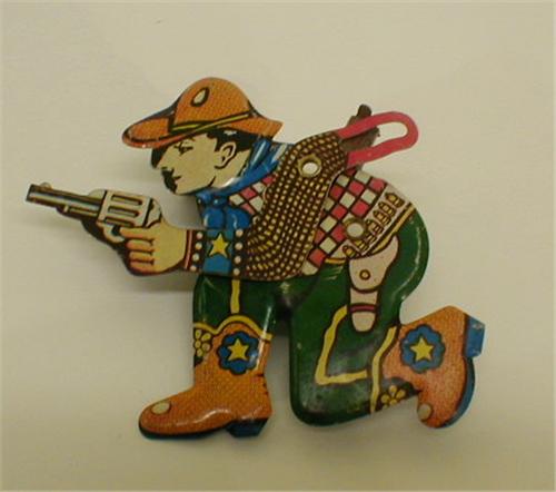 Tin cowboy clicker toy