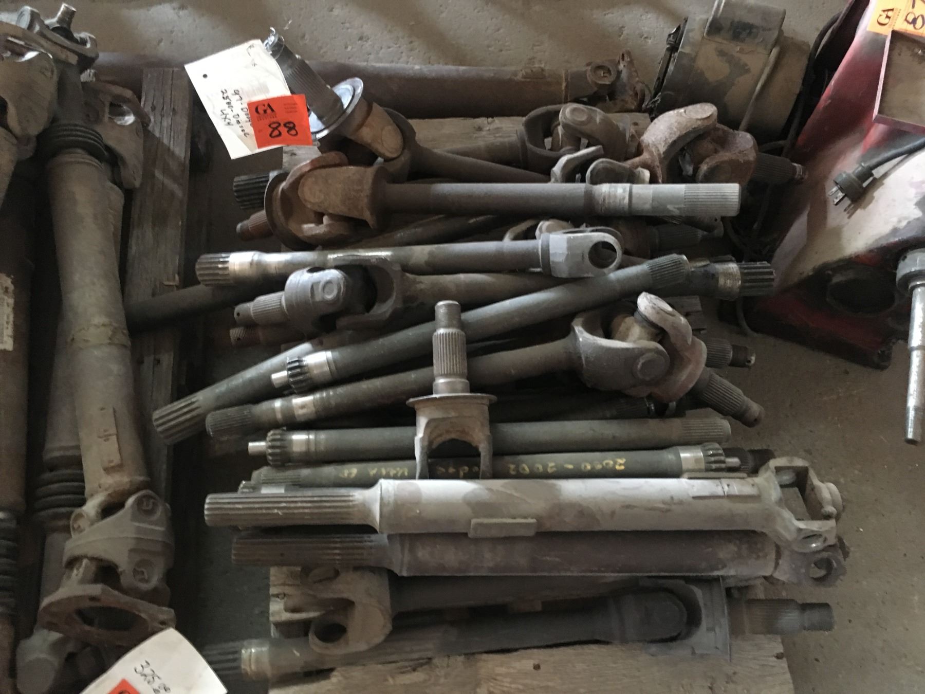 Pallet of used axles & drive shafts