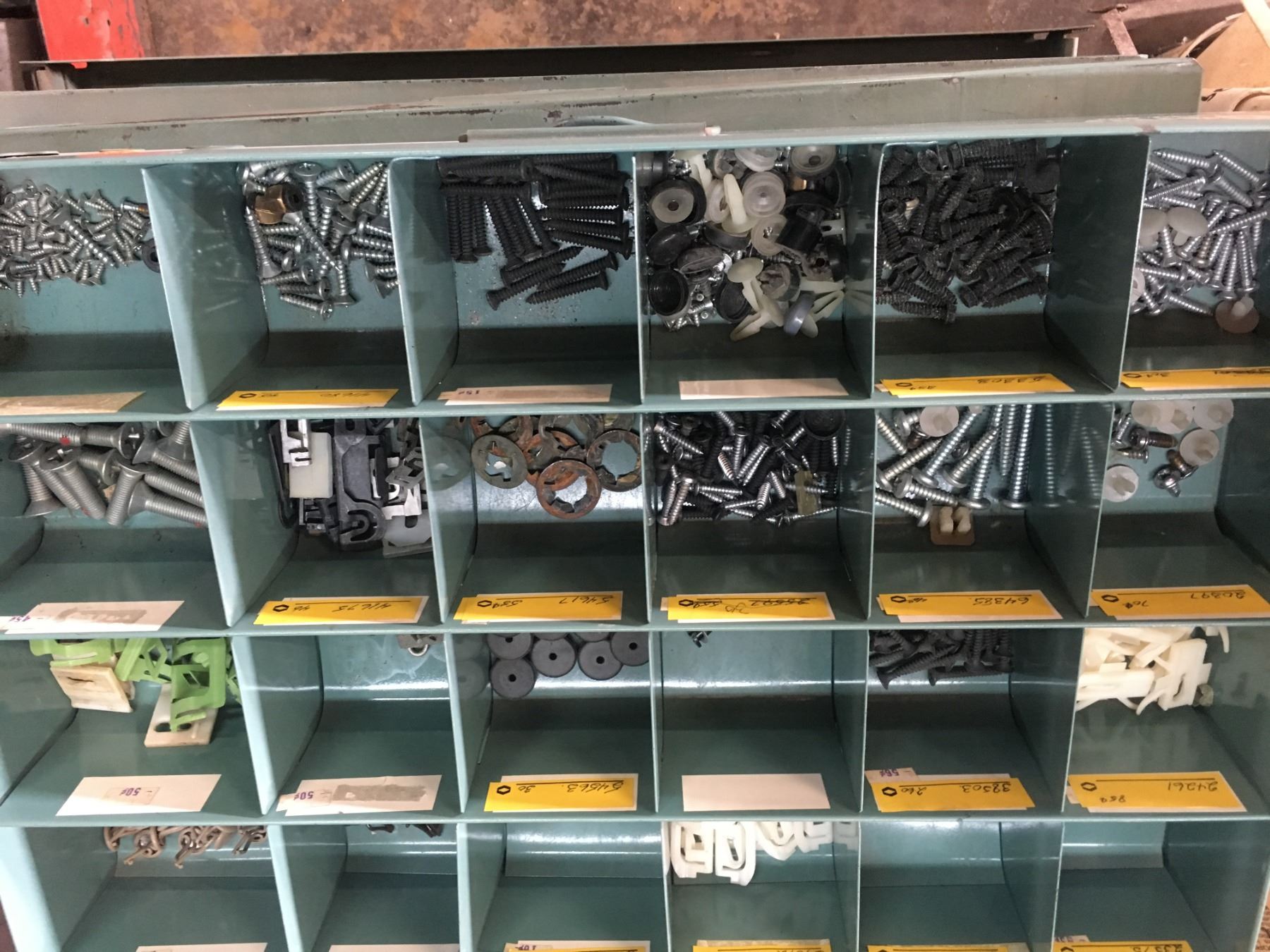 4 Curtis metal cases w/bumper bolts, lug nuts, clips, etc. plus 4 ...