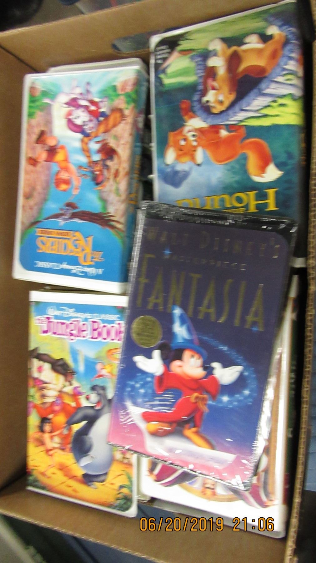 BOW WITH ASSORTED DISNEY VHS TAPES