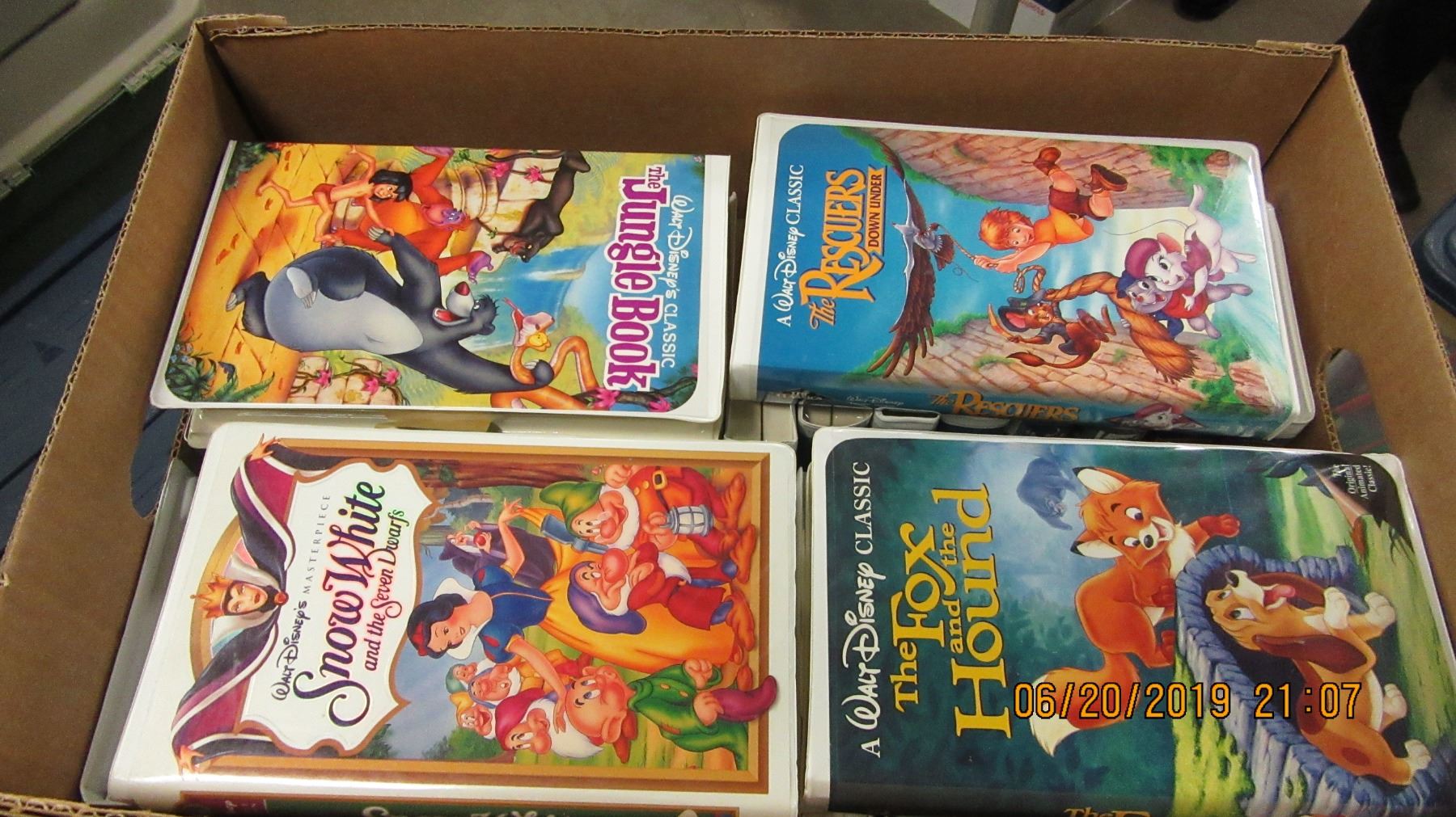 BOW WITH ASSORTED DISNEY VHS TAPES