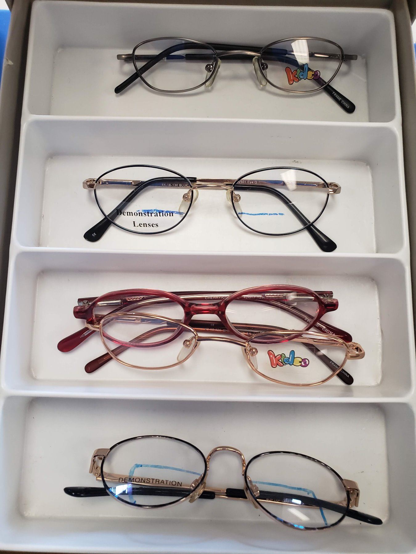 ASSORTED YOUTH GLASSES / FRAMES WITH FISHER PRICE DISPLAY BOX AND 2 CASES