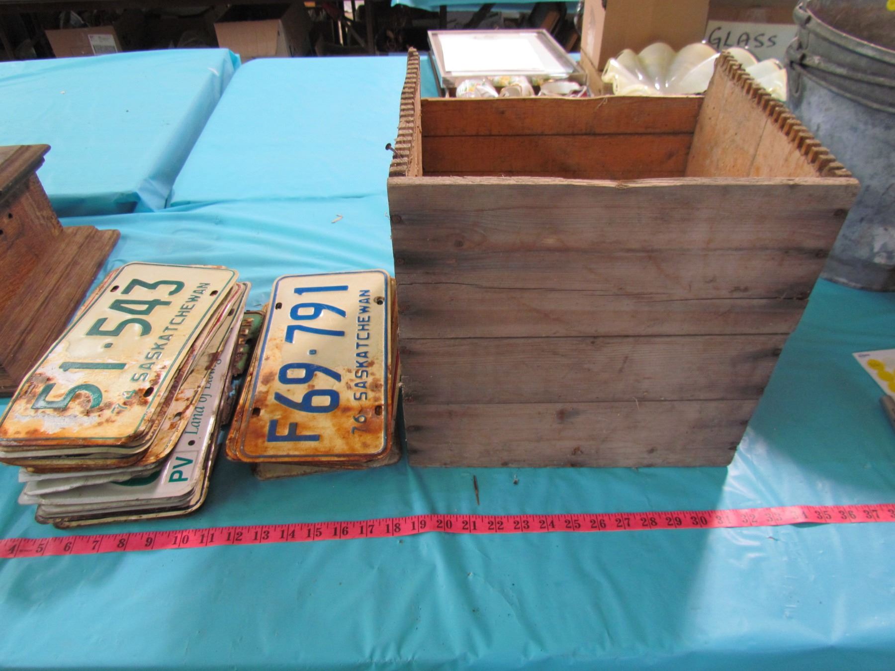 WOODEN BOX WITH ASSORTED LICENSE PLATES (BOX IS 13.5 X 13 X 12)
