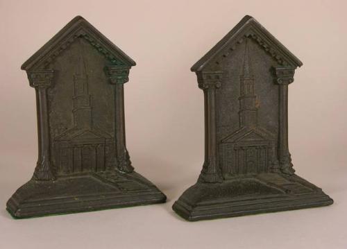 Two cast iron bookends depicting church